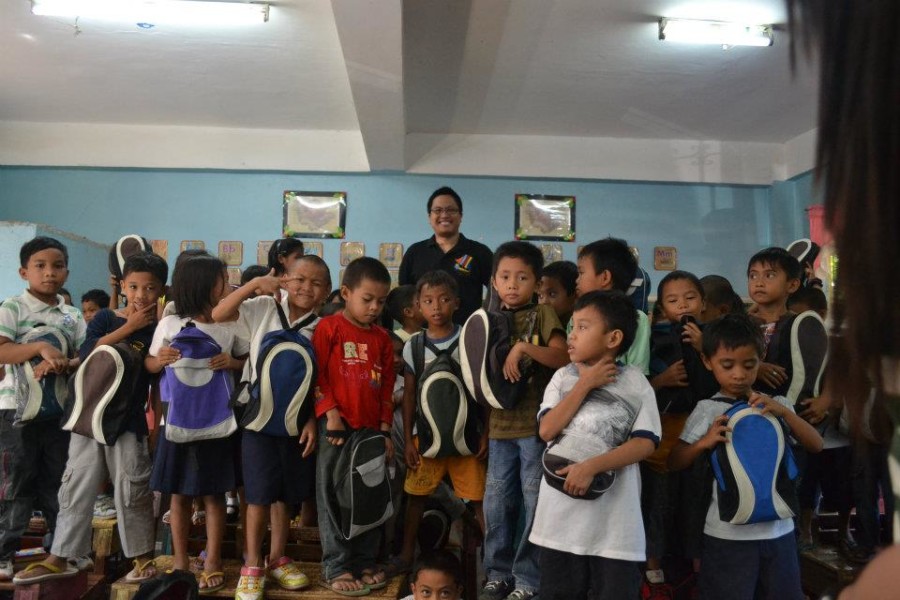 Giving school supplies for Sendong kids at Macanhan Elementary School in CDO - Five Point Five